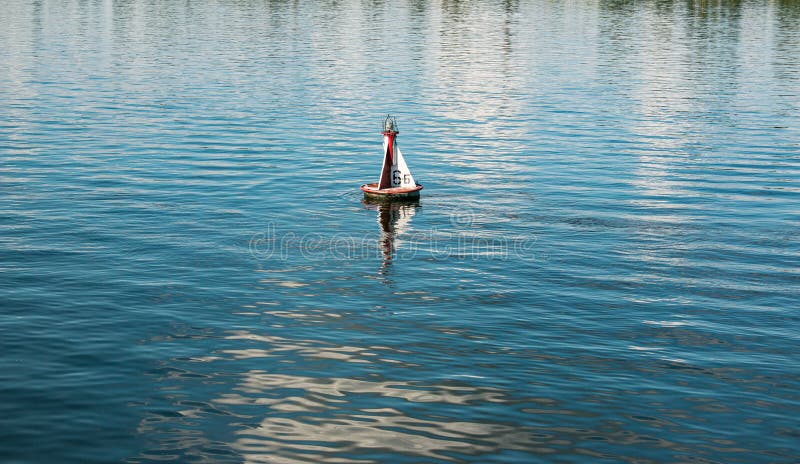 Floating Red Navigational Buoy on Blue Water of Dnipro River. Stock ...
