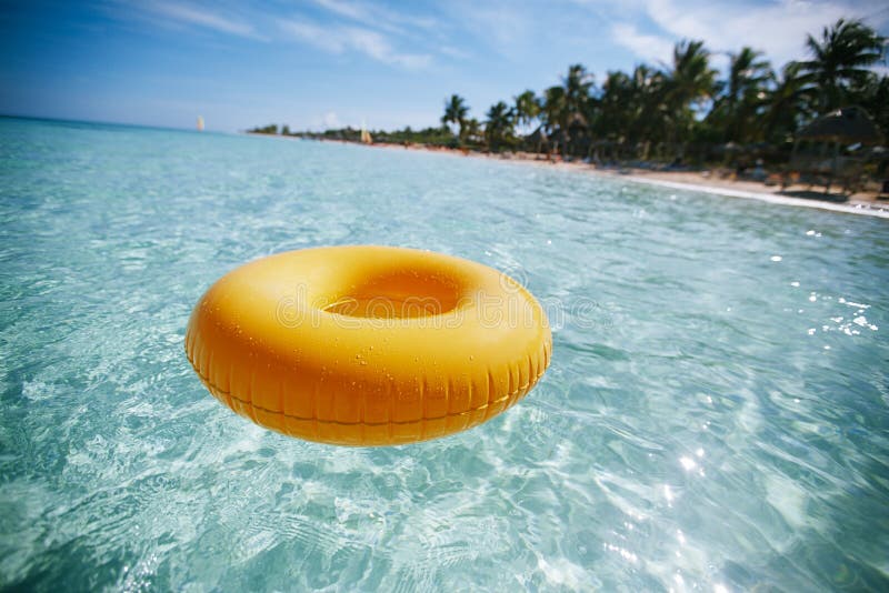 Floating Ring on Blue Clear Sea with Beach Stock Image - Image of ...