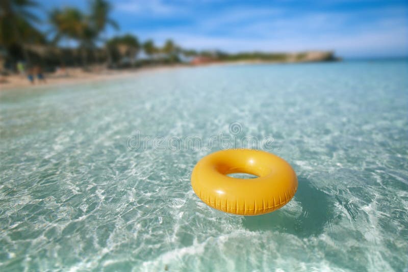 Floating Ring on Blue Clear Sea with Beach Stock Image - Image of tube ...