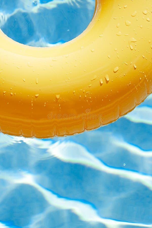 Floating Ring on Blue Water Swimpool with Waves Reflecting Stock Photo ...