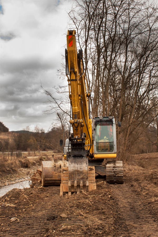 Flood Adjustments River. Work on the Riverbed. Excavator on the Work To ...