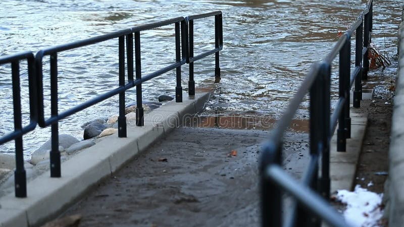 Flood Waters Overtake Walkway with Railing Stock Video - Video of ...