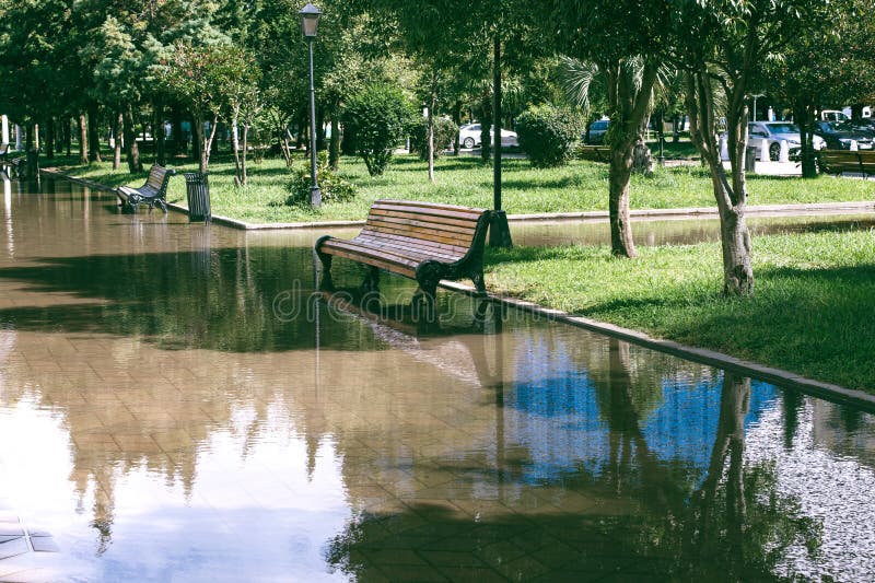 Flooded Boulevard Park with Bench after Heavy Rains Stock Image - Image ...
