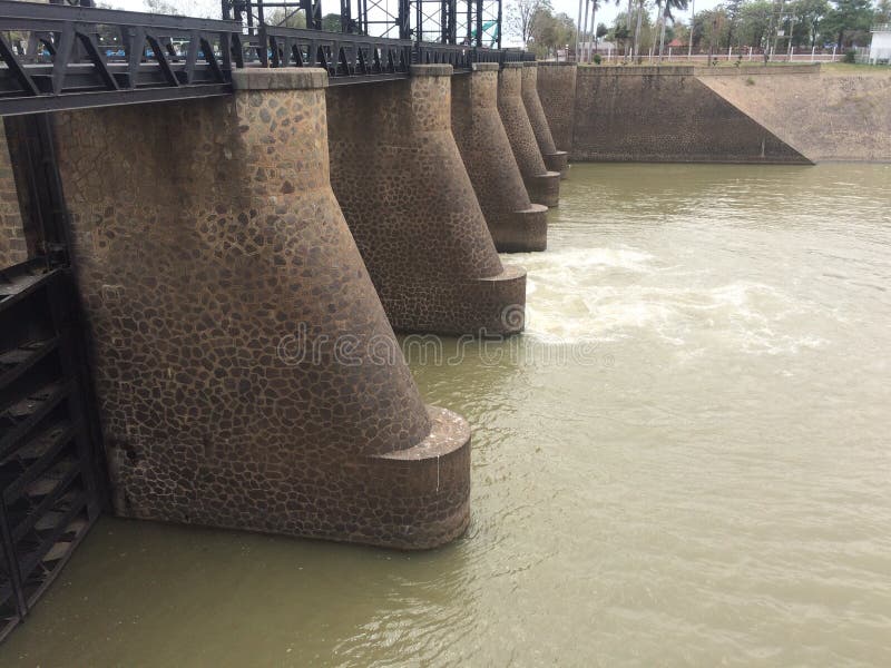 River with floodgate open stock photo. Image of regulate - 77305048