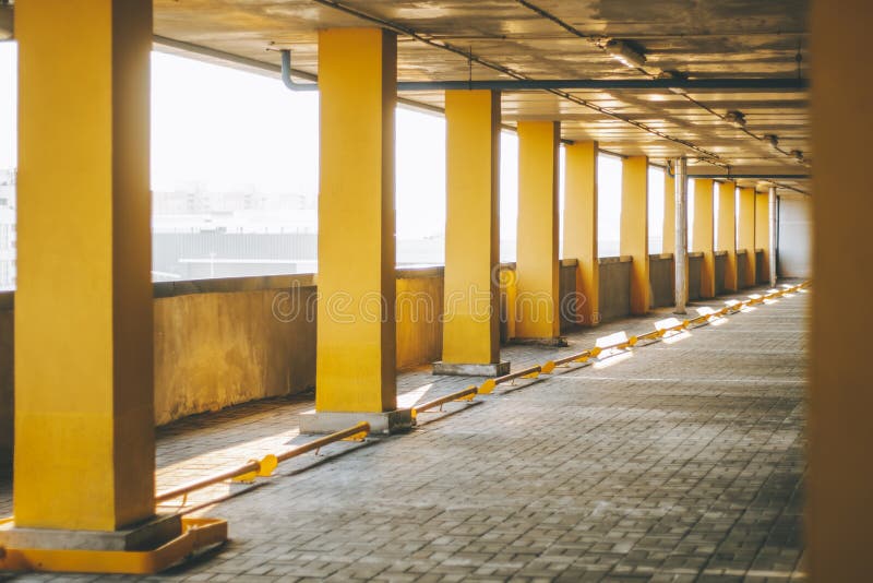 Floor of Above-ground Multi-level Car Park with Rows of Yellow Columns ...