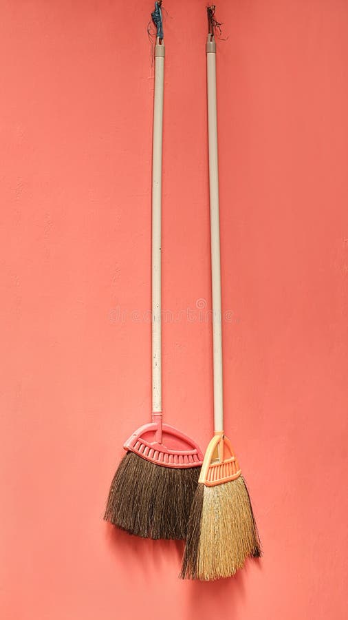 The Floor Brooms Hanging on a Pink Wall Stock Photo - Image of hygiene ...
