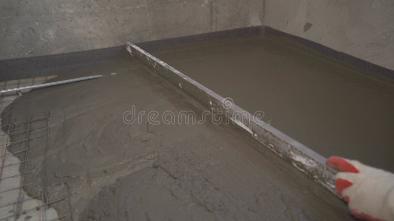 Floor Construction - Human Leveling of Concrete Screed. Leveling the ...