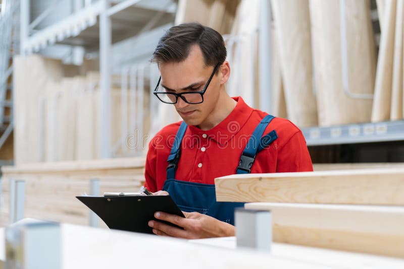 Floor Coverings Store Supervisor Making Notes on the Clipboard . Stock ...
