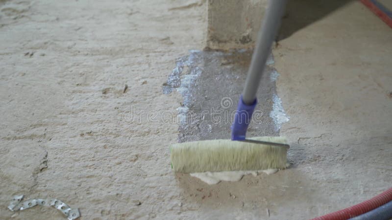 Floor Primer for Wall Construction. Construction Worker with Paint ...
