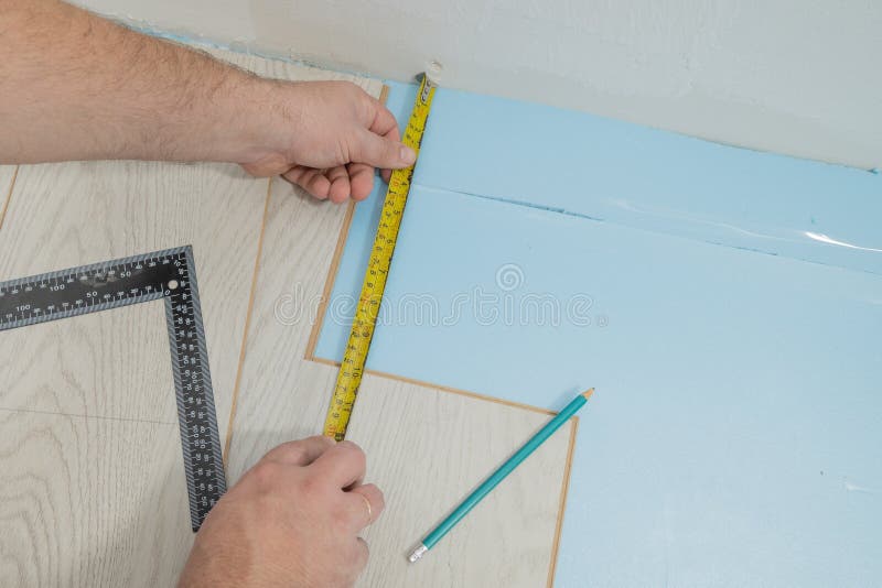 Floor Renovation. Measuring before Setting of the Laminate Floor Stock ...
