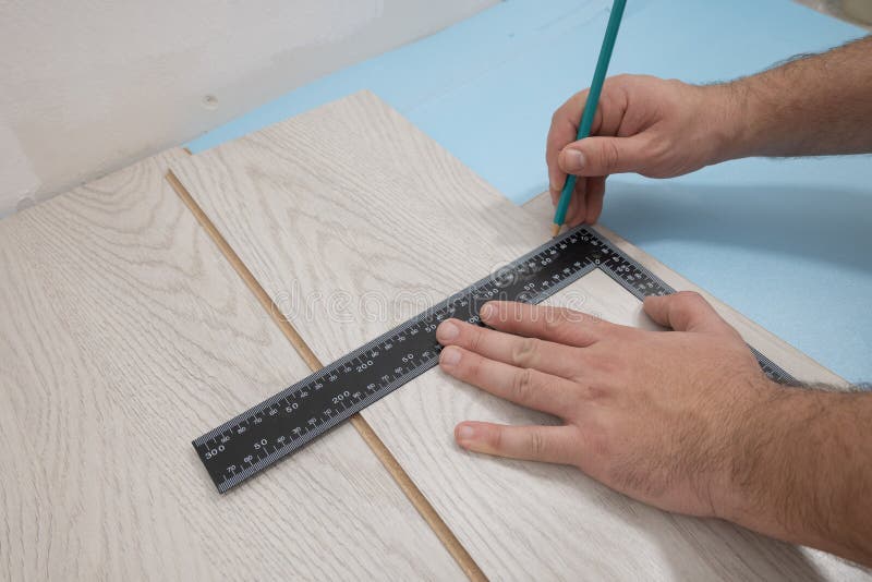 Floor Renovation. Measuring before Setting of the Laminate Floor Stock ...