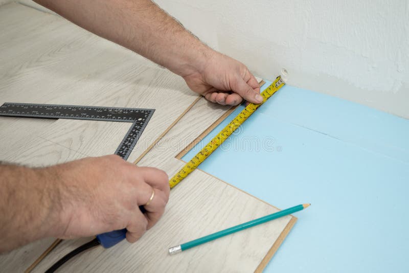 Floor Renovation. Measuring before Setting of the Laminate Floor Stock ...