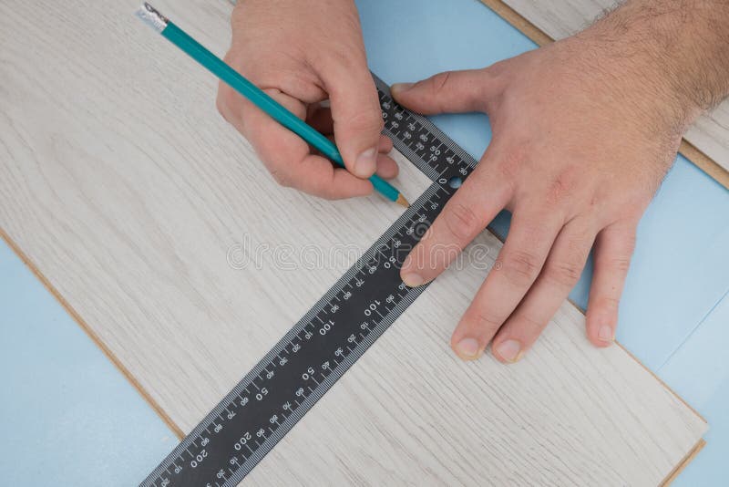 Floor Renovation. Measuring before Setting of the Laminate Floor Stock ...