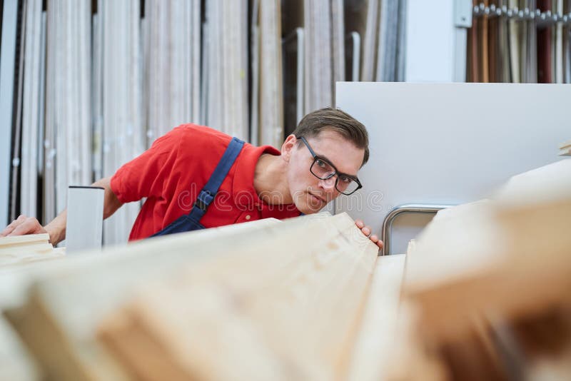 Floor Shop Manager Looking at Laminate Board Samples . Stock Image ...