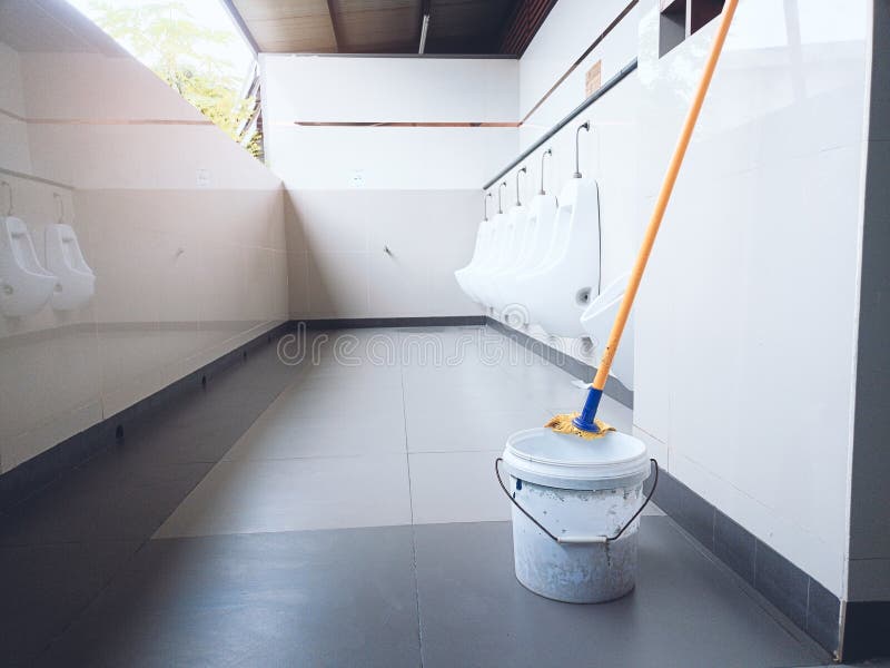 A Floor Support Stick is Placed in the Restroom of a Gas Station Stock ...
