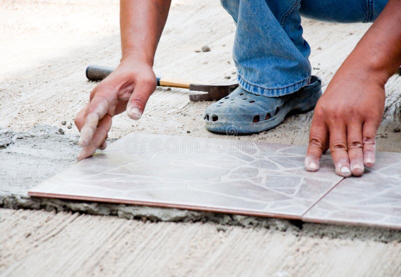 Man laying floor tile stock image. Image of trade, improvement - 11443401