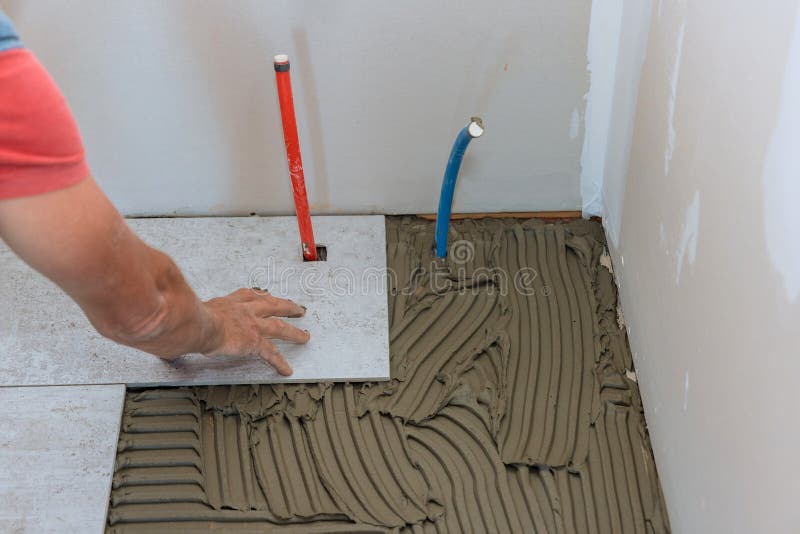 Tiler Placing Porcelain Tile in Position Over Adhesive Stock Photo ...