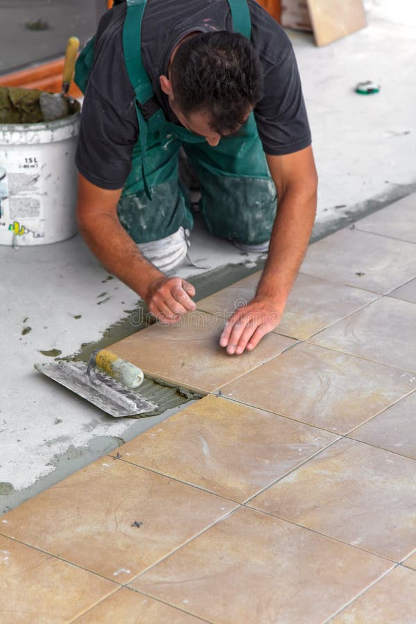 Floor tiles installation stock image. Image of arrange - 11163651