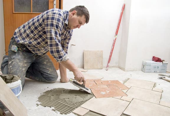 Floor tiles installation stock image. Image of concrete - 3511619