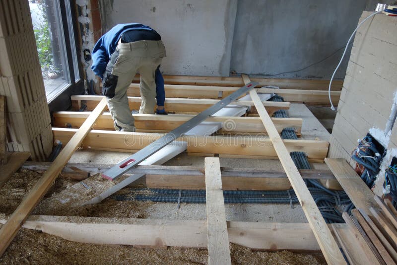Floorer Laying a Floor in a Building Stock Photo - Image of labor ...