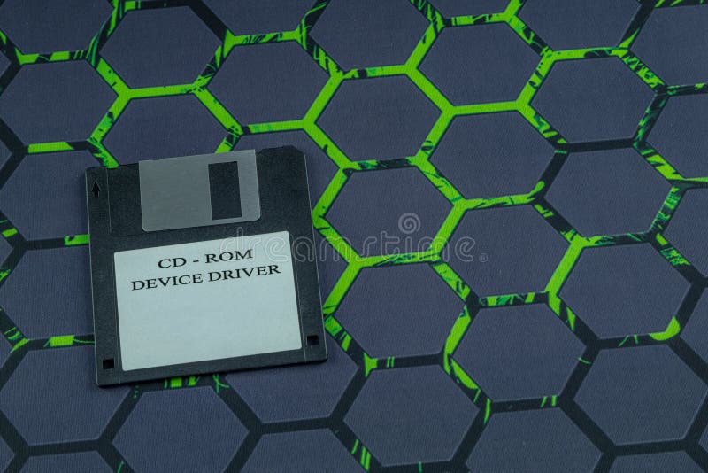 A Floppy Disk from an Old Computer Placed on a Black Mouse Pad Stock ...