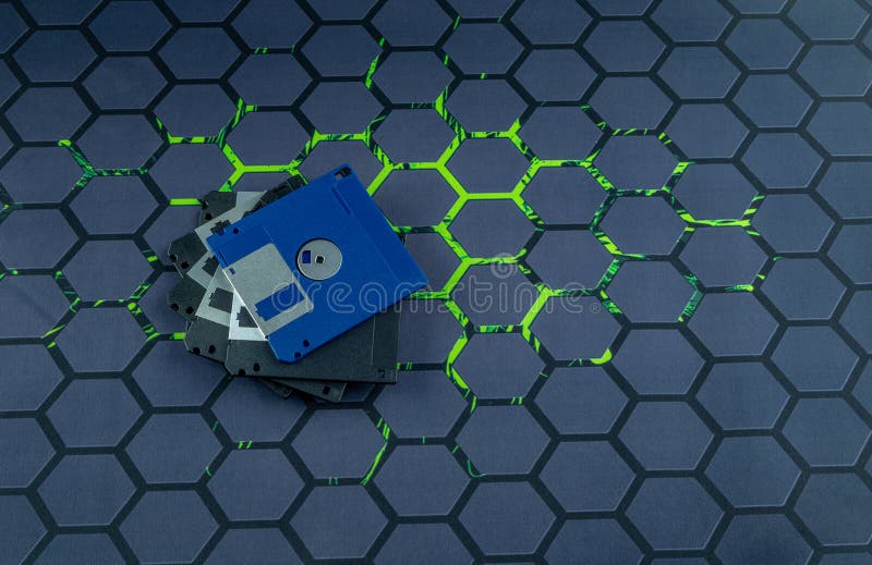 A Floppy Disk from an Old Computer Placed on a Black Mouse Pad Stock ...