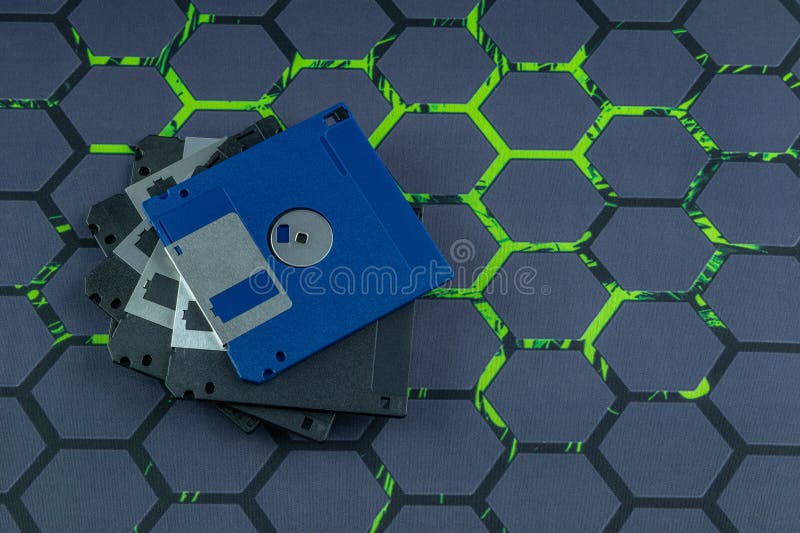 A Floppy Disk from an Old Computer Placed on a Black Mouse Pad Stock ...