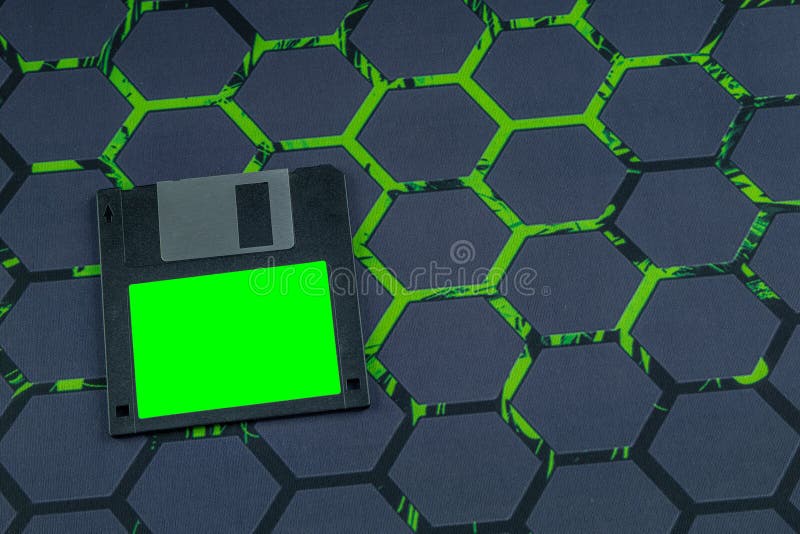A Floppy Disk from an Old Computer Placed on a Black Mouse Pad Stock ...