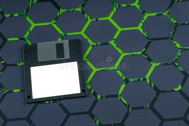 A Floppy Disk from an Old Computer Placed on a Black Mouse Pad Stock ...