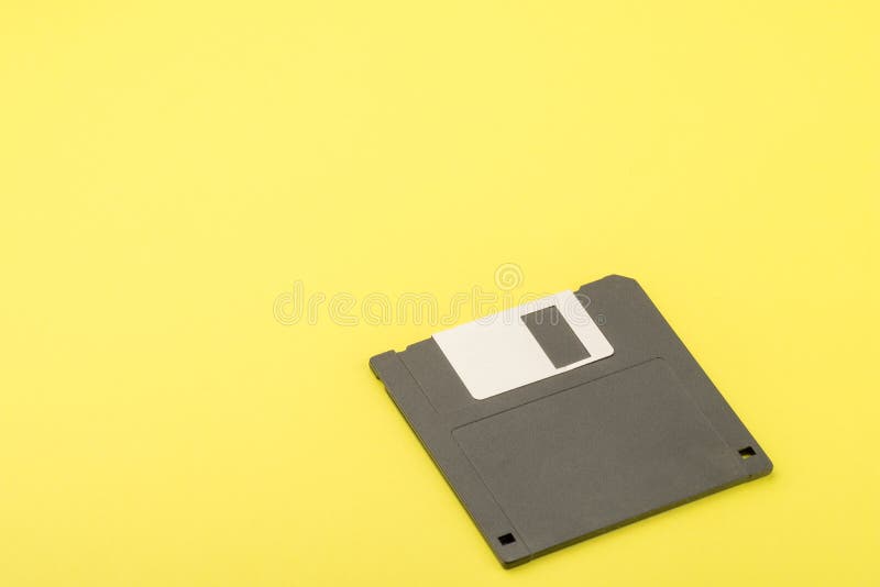 Floppy Disk on a Yellow Paper Background Stock Image - Image of ...