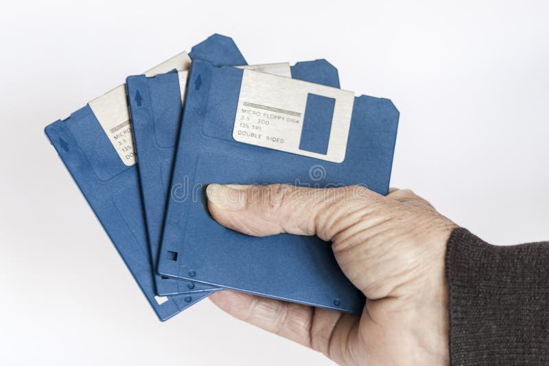 Floppy disks in the hand stock photo. Image of computer - 89473316