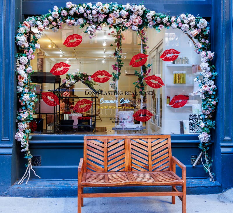 A Floraly Bench Sits in Front of a Window Display Editorial Photography ...