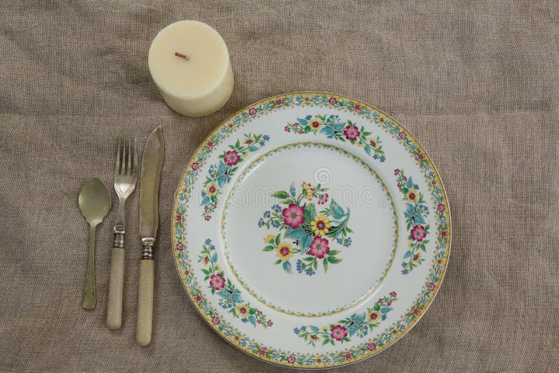 Floral Pattern Plate with Cutlery Set and Candle Stock Image - Image of ...