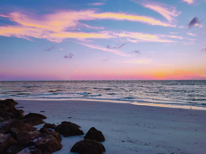 Florida Beach Sunset Colors Oceanview Rocks Sand Clouds Stock Image ...