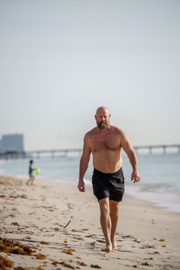 Florida Man Walking on the Beach Stock Image - Image of bald, caucasian ...