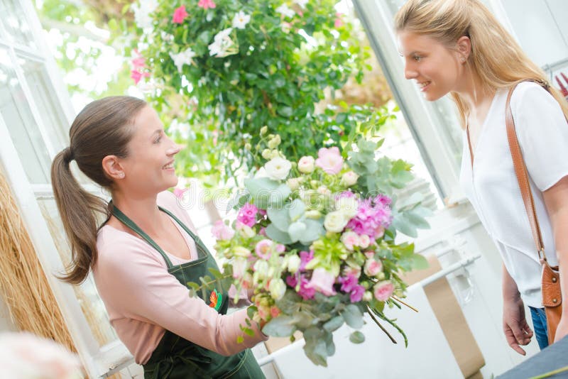 Florist Giving Lady Flower Arrangement Stock Photo - Image of botanical ...