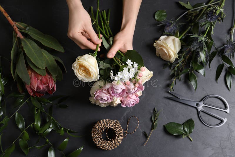 Florist Making Beautiful Bouquet at Black Table, Top View Stock Image ...