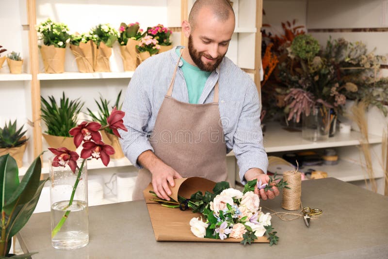 Florist Making Bouquet with Flowers at Table in Shop Stock Image ...
