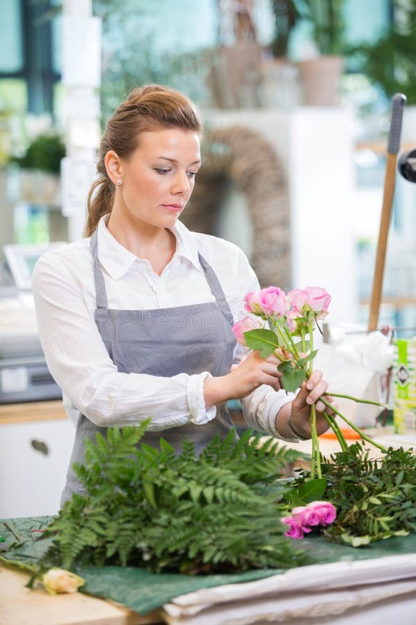Florist making bouquet stock photo. Image of employee - 20887762