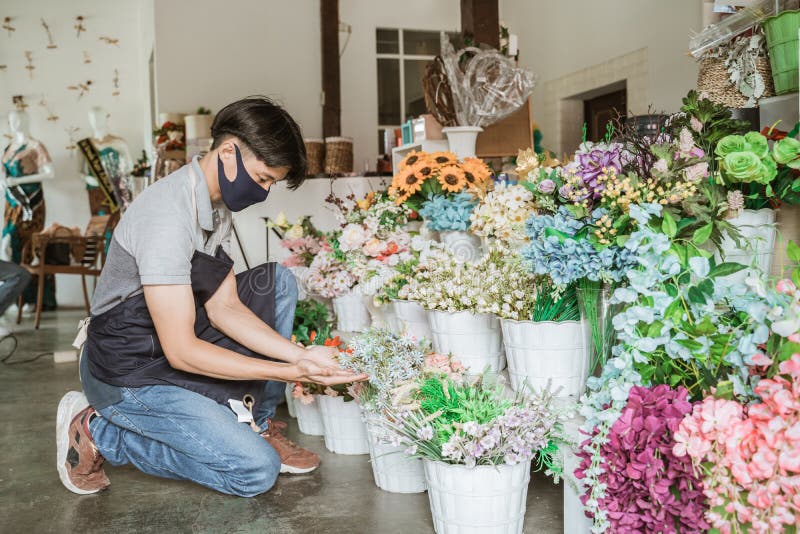 Florist Man Using Face Mask Checking a Flower Bouquet Stock Image ...