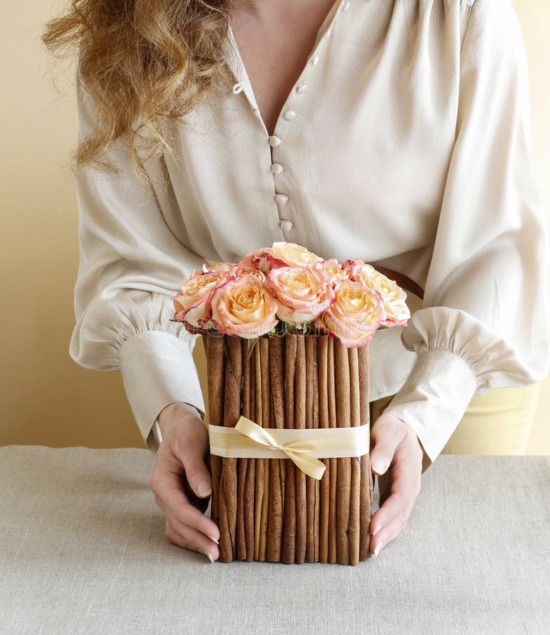 How To Make Floral Arrangement with Roses and Cinnamon Sticks Stock ... How To Make Floral Arrangement with Roses and Cinnamon Sticks Stock ...