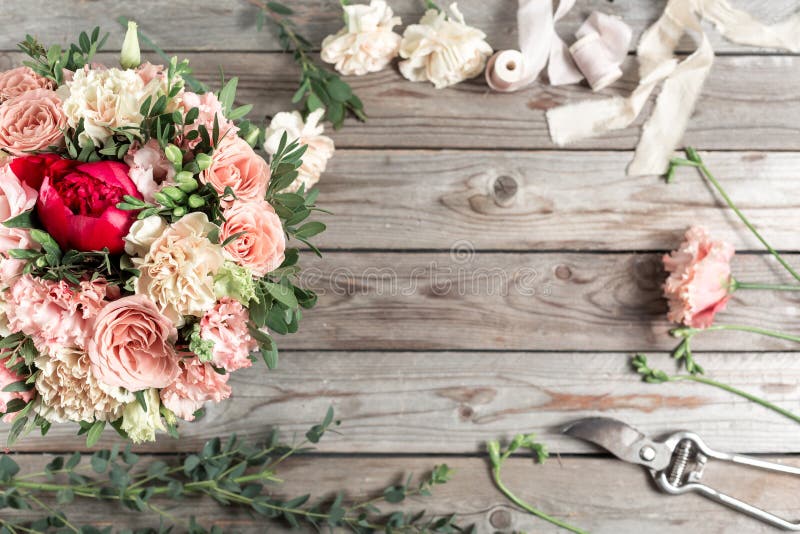 The Florist Work Table with Tools on Gray Wooden Background. Copy Space ...