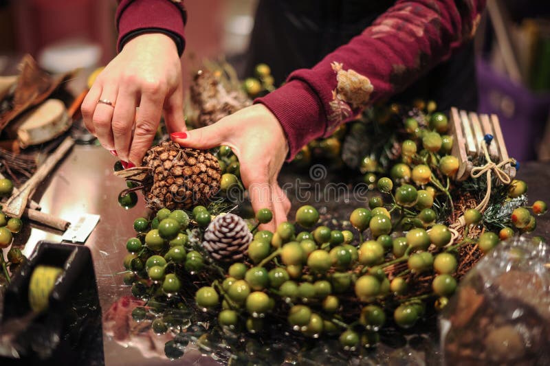 Florist at Work: Woman Making Wreath Stock Photo - Image of festive ...
