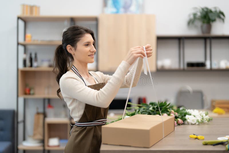 Florist Working with Flowers Making a Composition Ghift Box Stock Photo ...
