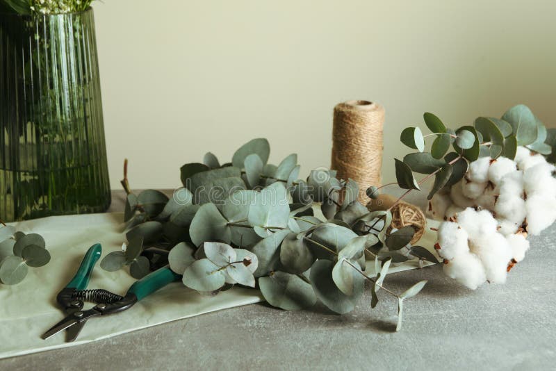 Floristic Concept with Eucalyptus, Flowers and Cotton on Gray Table ...