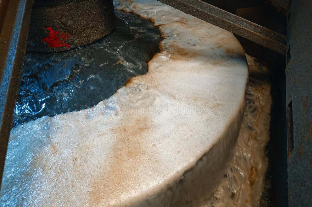 Flotation Machine. a Stream of Gray, Dirty Foam Flows from the ...