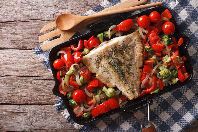 Flounder with Vegetables on a Frying Pan. Horizontal Top View Stock ...