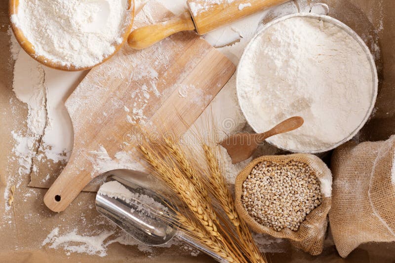 Flour in a Bowl and Wheat Grains with Wheat Ears on the Table, Paper ...