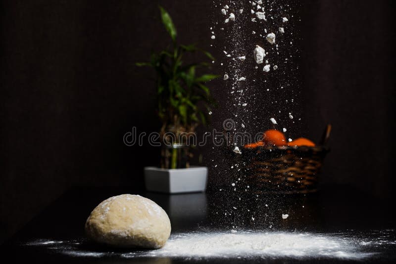 Flour Falling on a Dark Table. Preparing the Homemade Bread Making ...