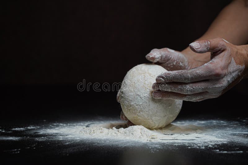 Flour Falling on a Dark Table. Preparing the Homemade Bread Making ...